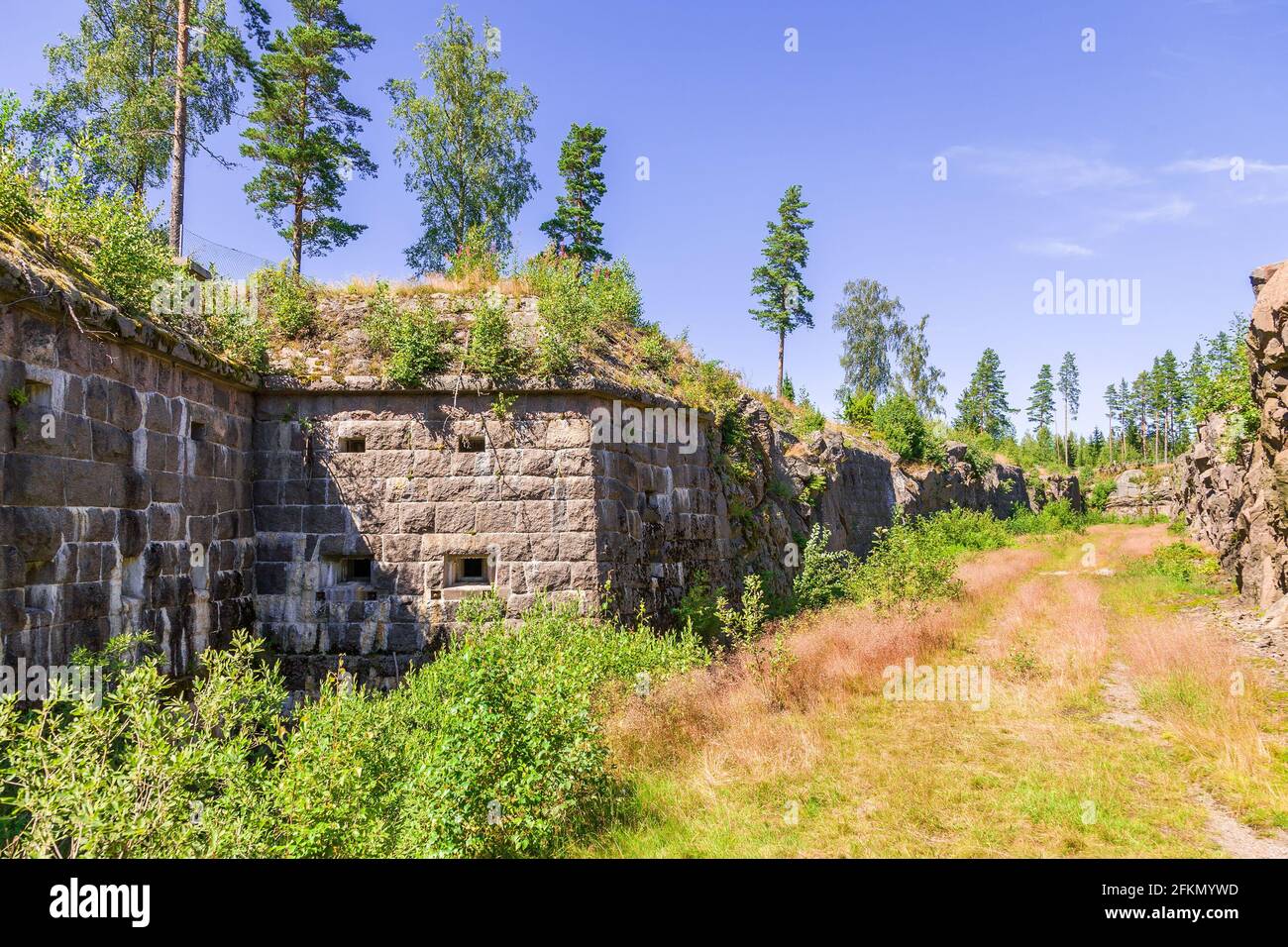 Moat into an old fortress embedded in solid rock Stock Photo - Alamy
