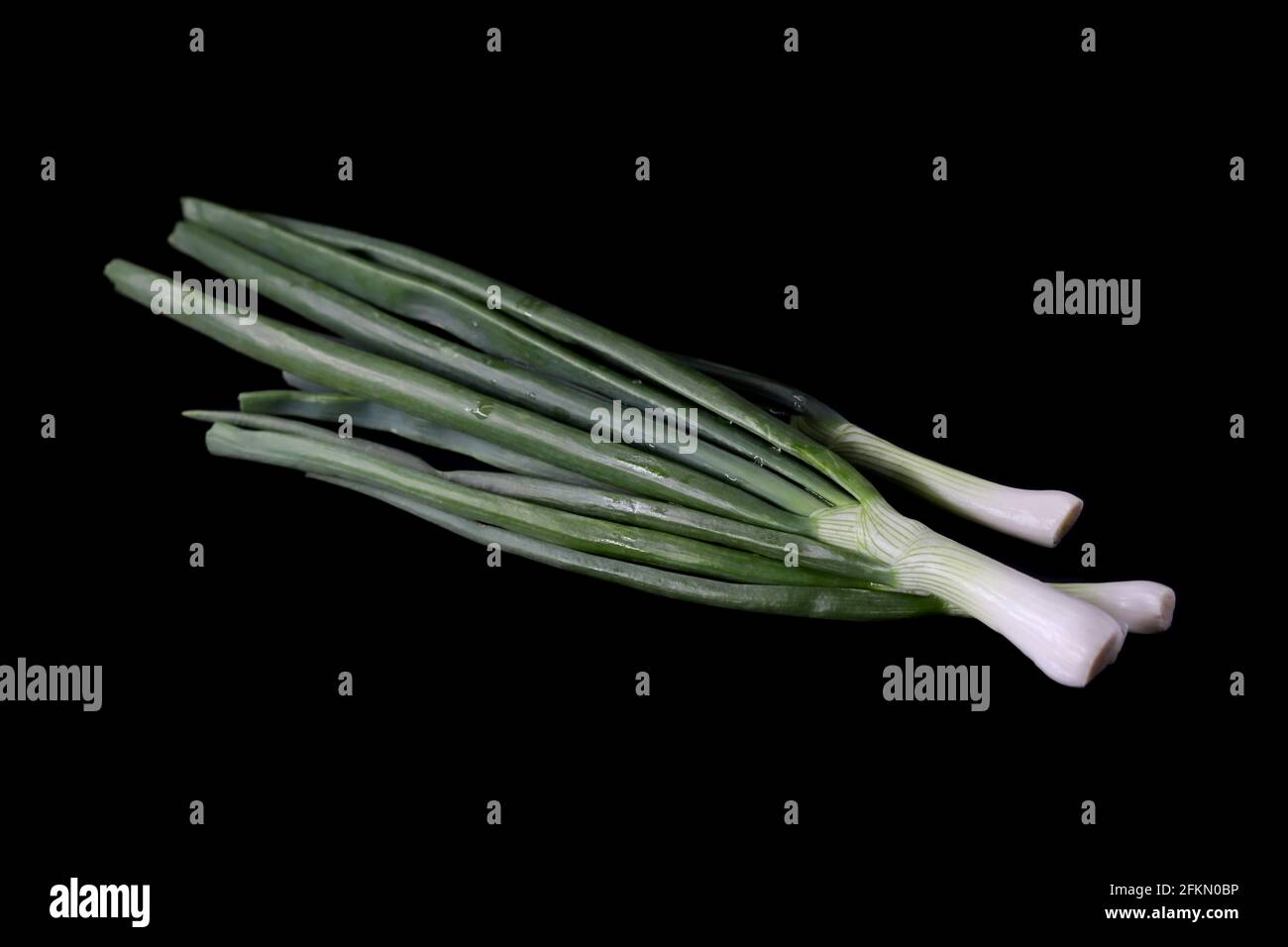 Bunch green onions on black hi-res stock photography and images - Alamy
