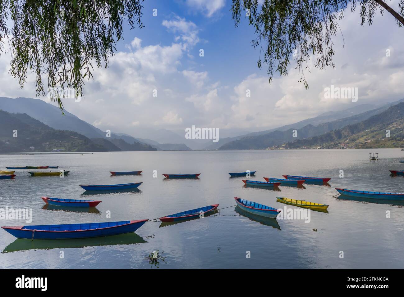Boats and mountains at the Phewa lake in Pokhara, Nepal Stock Photo - Alamy