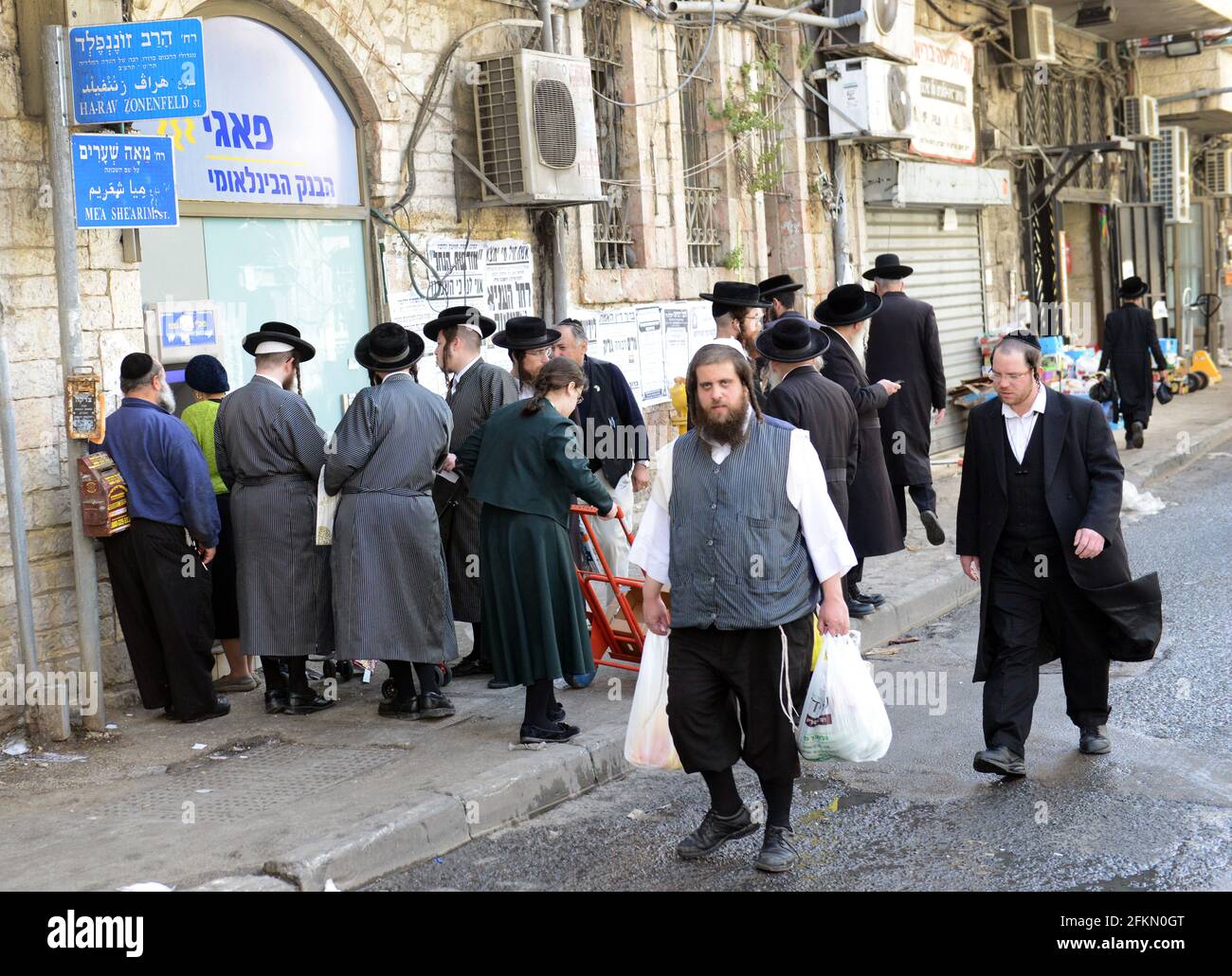 Toldos Aharon Jewish men socializing on Mea She'arim street in ...