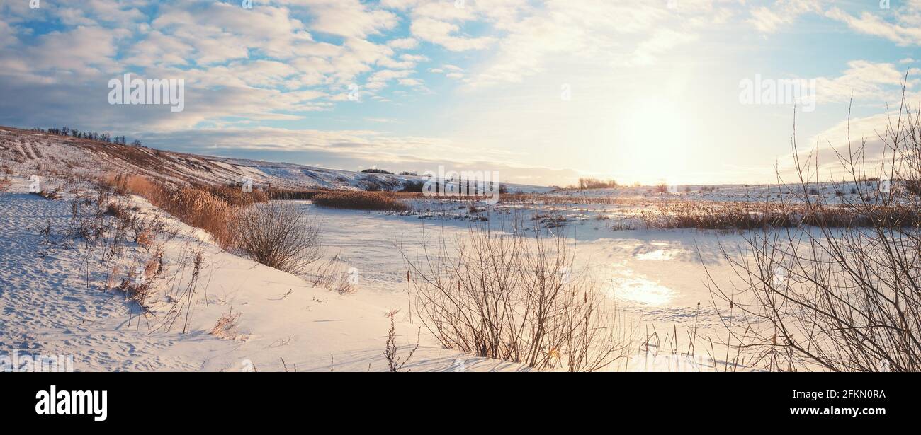 Sunny panoramic early springtime landscape.Beautiful view of frozen ...