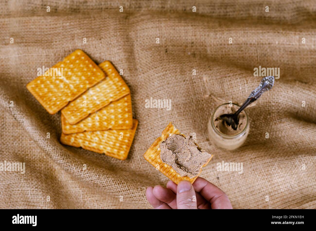 Man hand holding cracker hi-res stock photography and images - Alamy