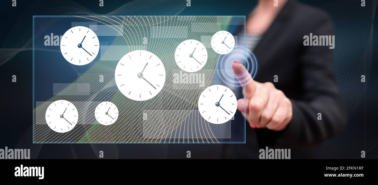 Woman touching a time management concept on a touch screen with her ...