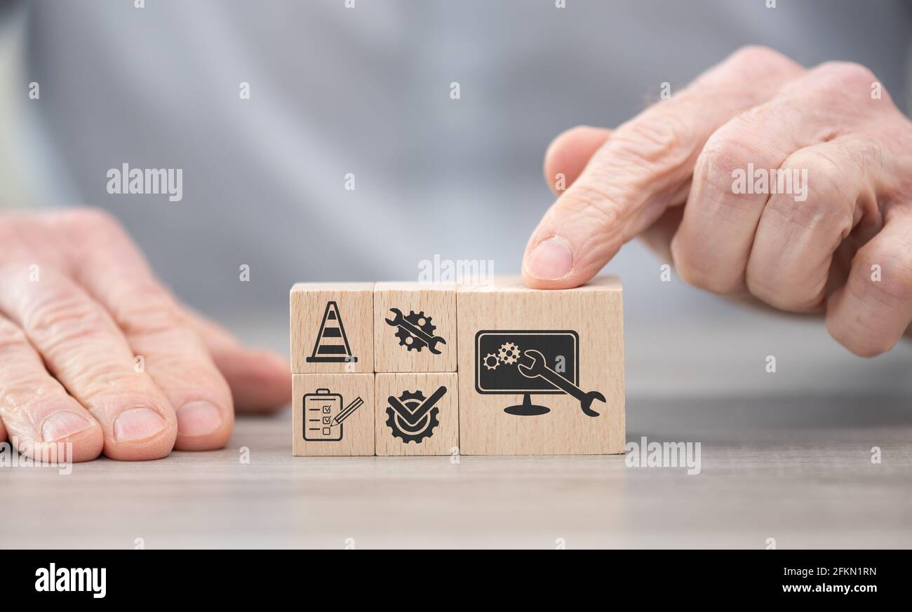 Wooden blocks with symbol of system maintenance concept Stock Photo - Alamy