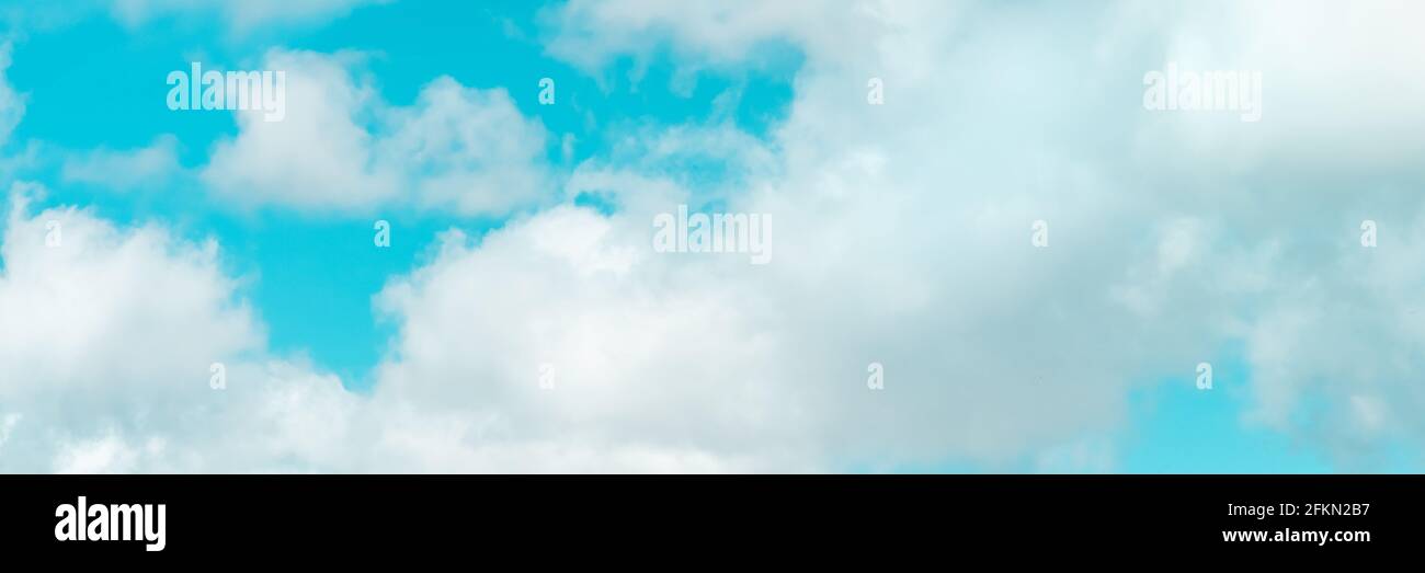 White clouds on a blue sky panorama. Abstract header for design Stock ...