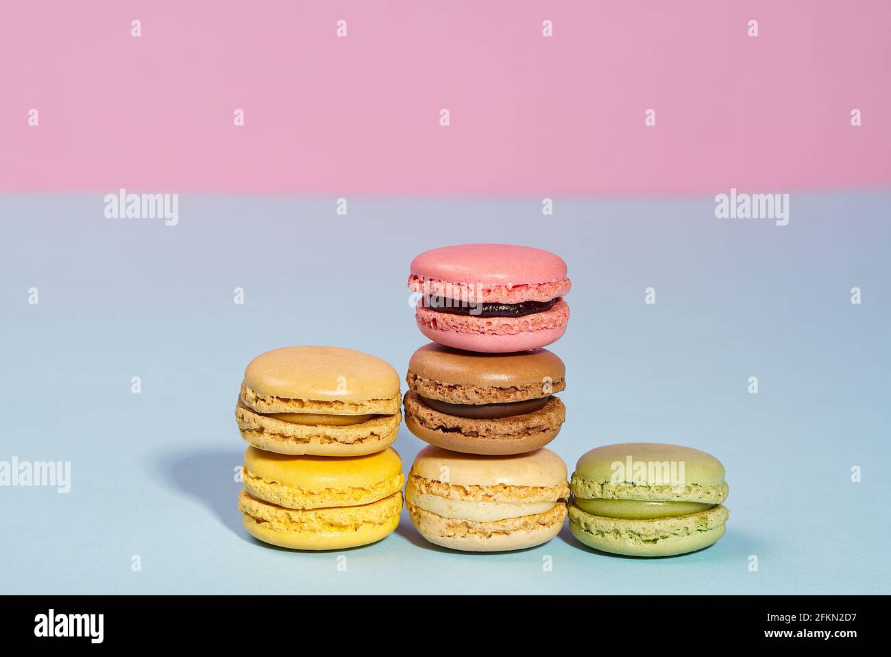 French dessert macaron on pink and blue background. Modern Macarons on ...