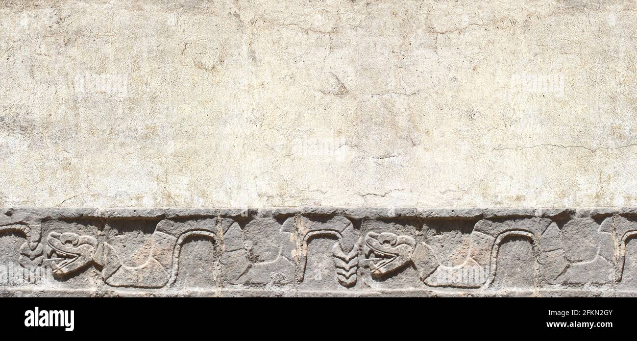 Grunge background with stone wall texture and bas-relief carving of a ...