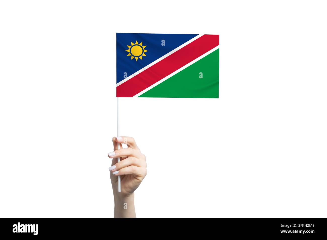 Beautiful female hand holding Namibia flag, isolated on white ...