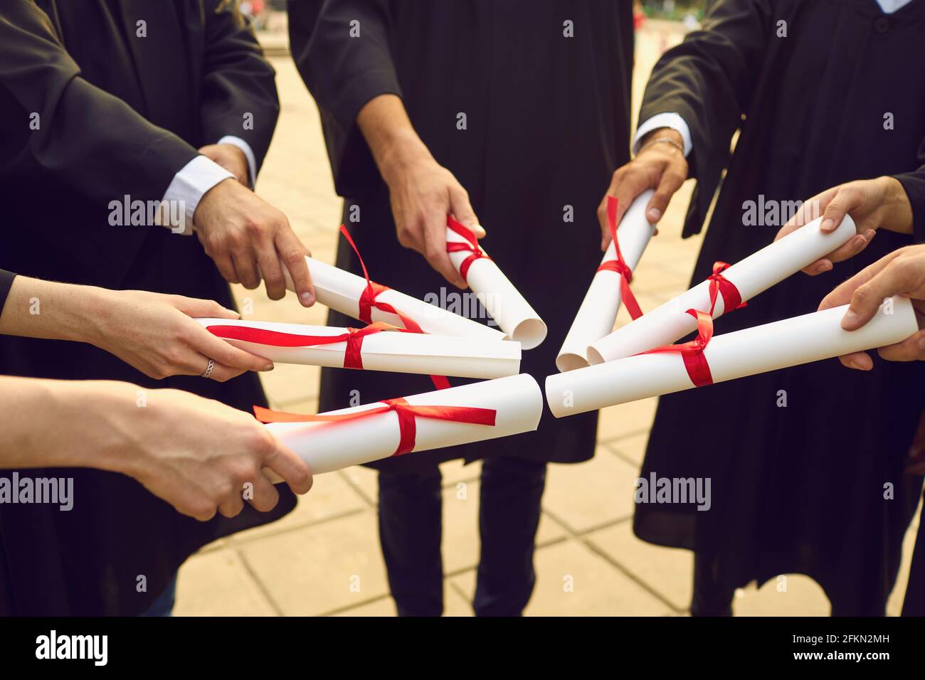 Hands holding diploma hi-res stock photography and images - Alamy