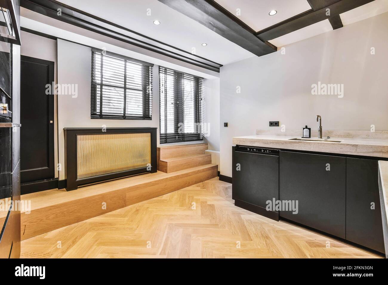 Open plan spacious kitchen with ceiling beams Stock Photo - Alamy
