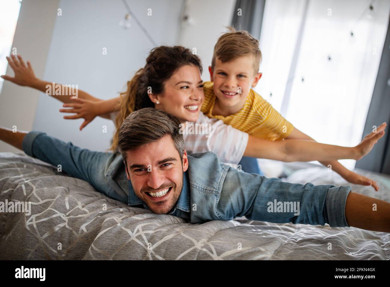 Happy family having fun time at home Stock Photo - Alamy