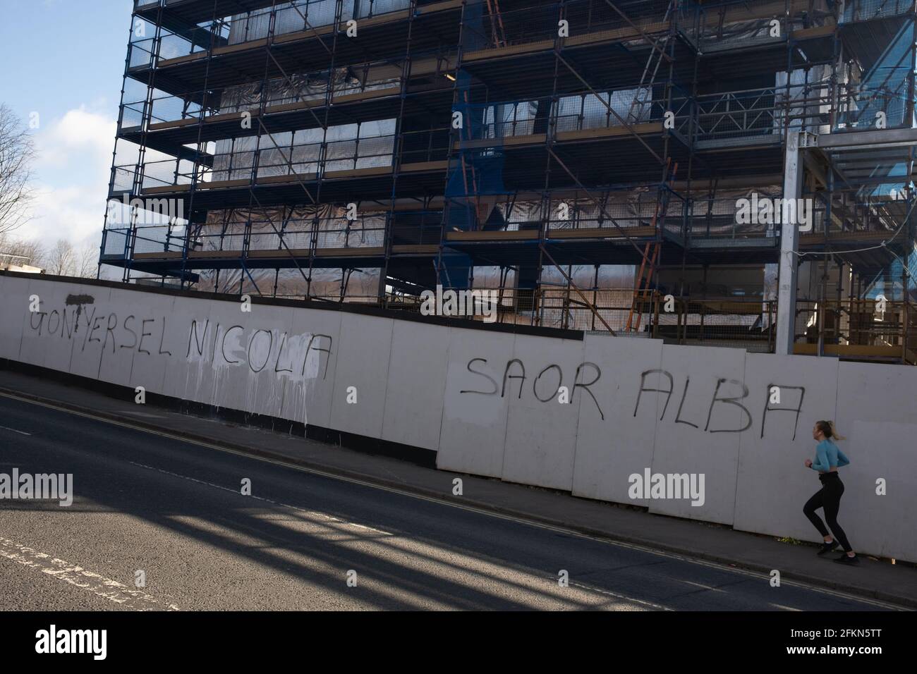 'Gon Yersel Nicola' and 'Saor Alba' graffiti on a building site in ...