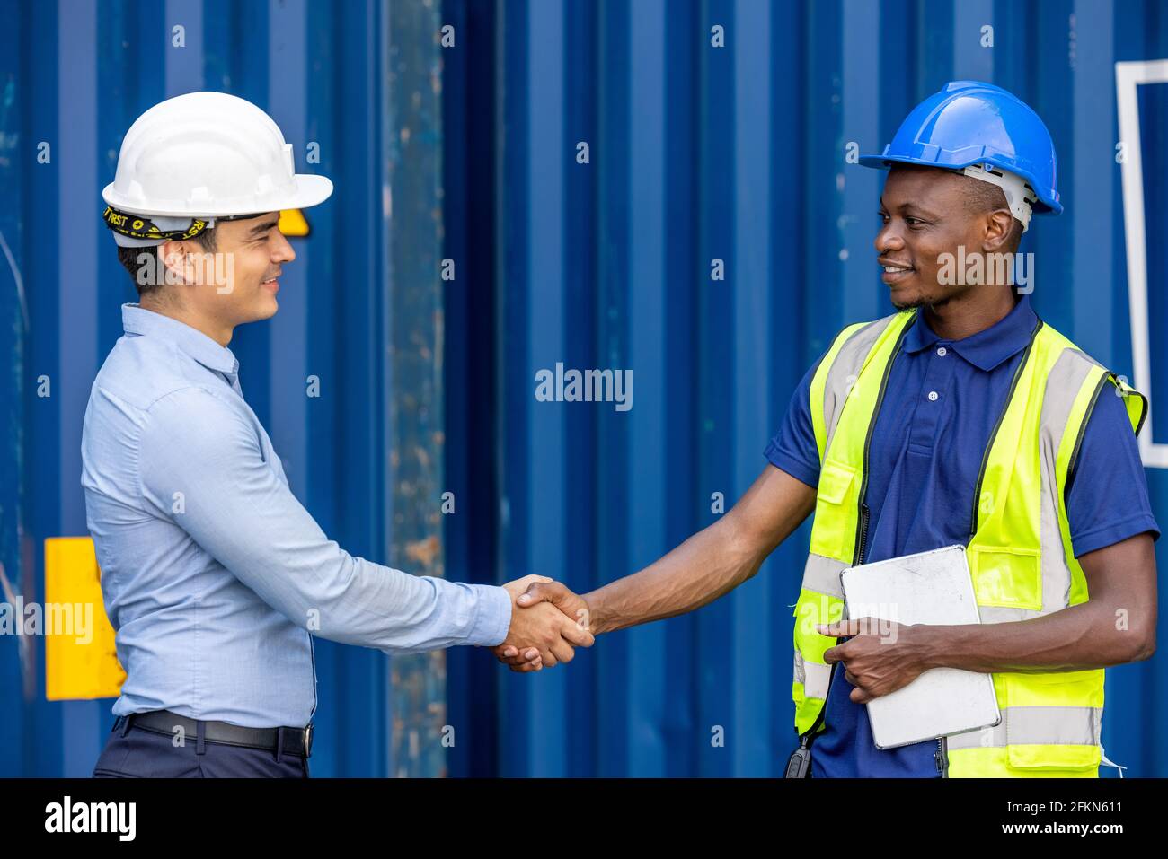 Teamwork cooperation of international container shipping multi ethnic ...