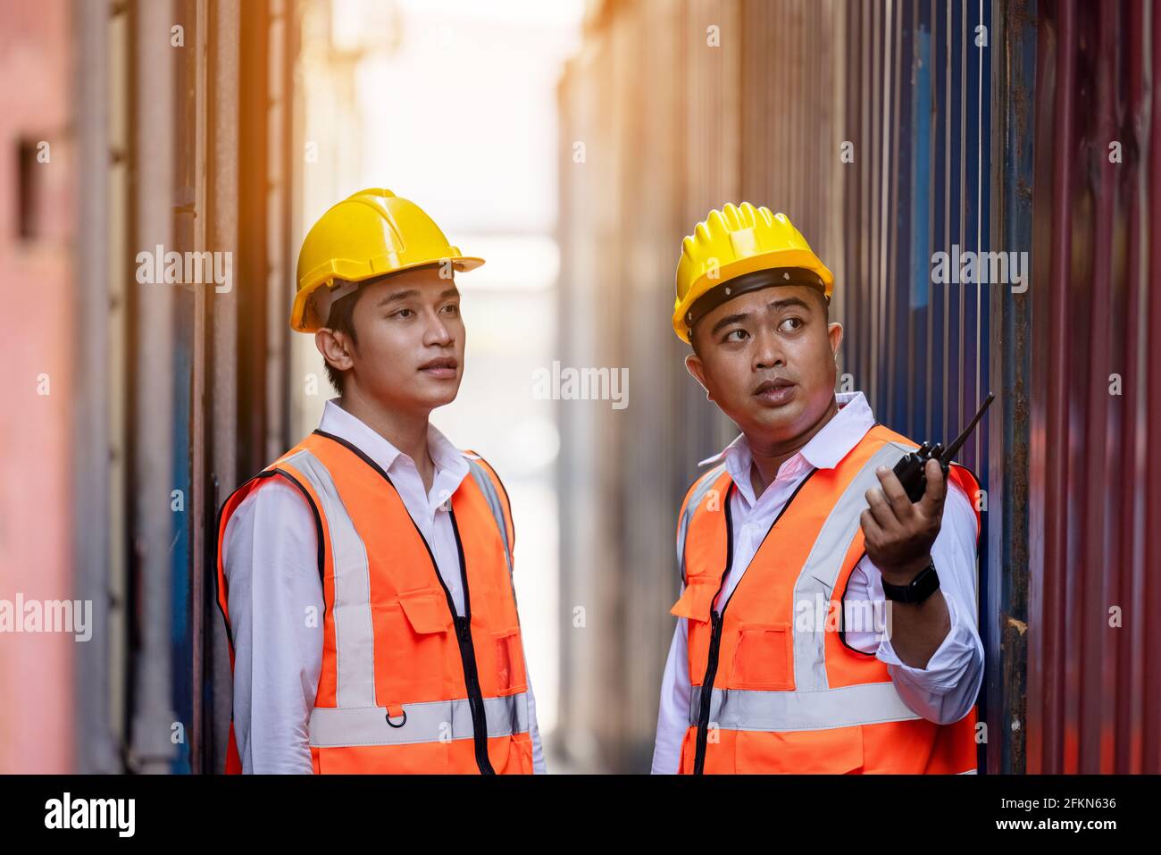 Two factory workers or engineers looking and pointing something in ...