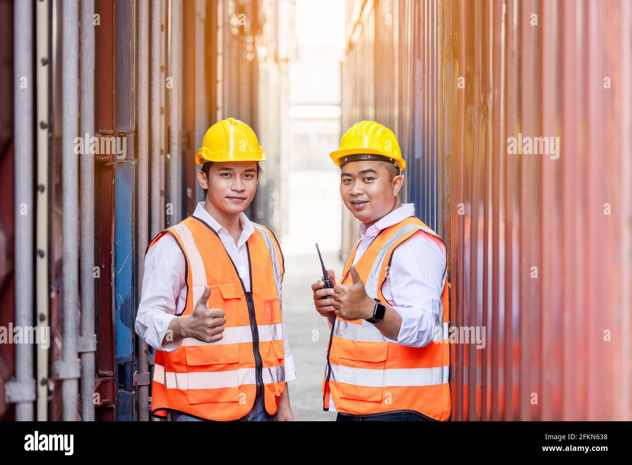 Two factory workers or engineers looking and pointing something in ...
