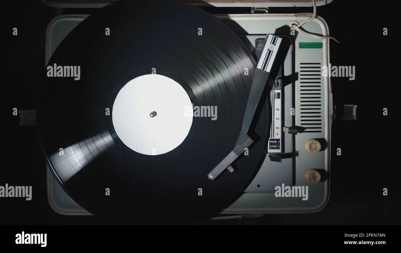 Photo of a gramophone with a spinning vinyl record, top view Stock ...
