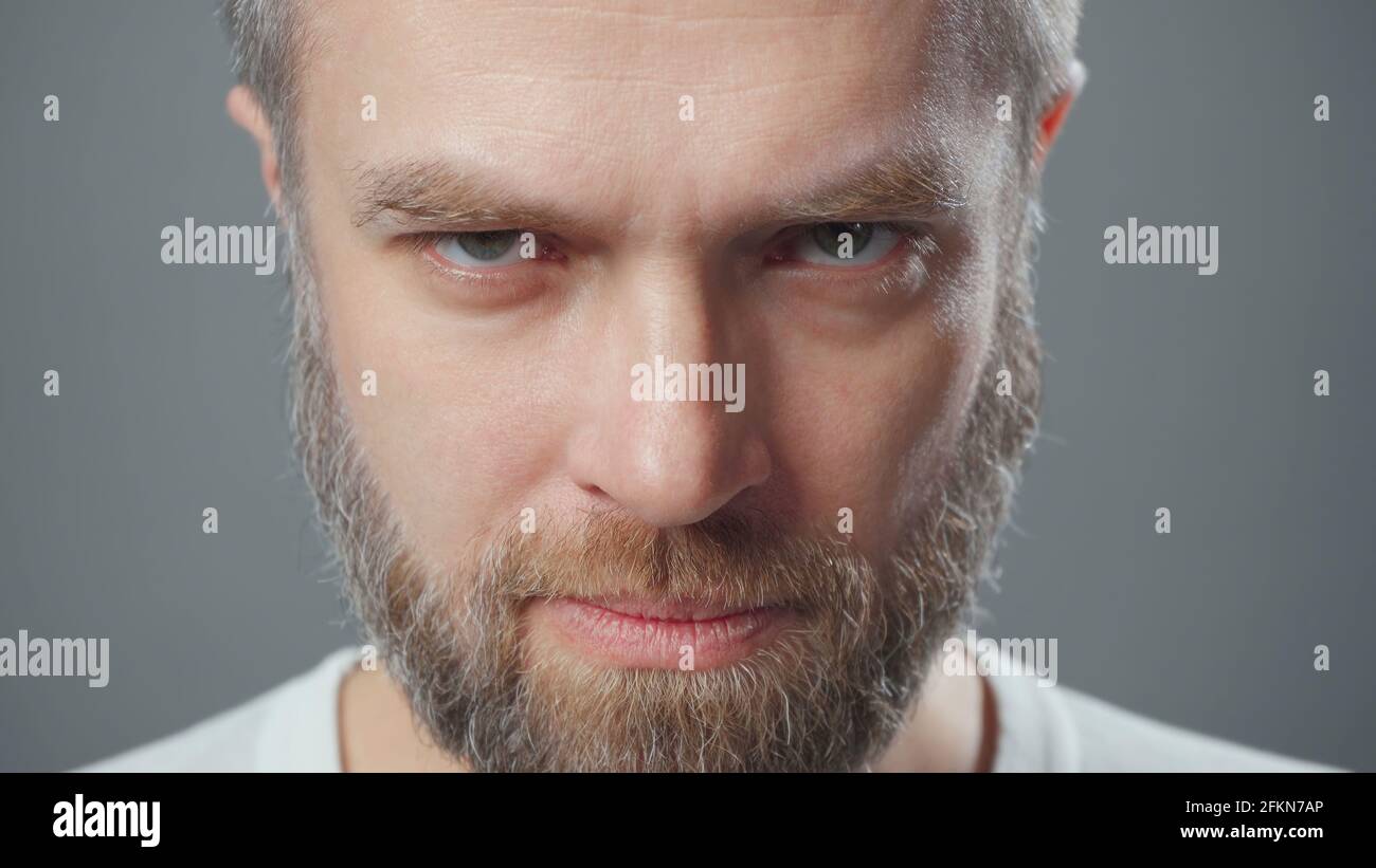 Extreme close-up photo of man looking under his brows Stock Photo - Alamy