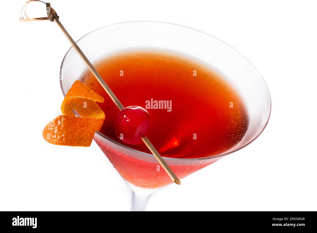 Traditional Manhattan cocktail with cherry isolated on white background ...