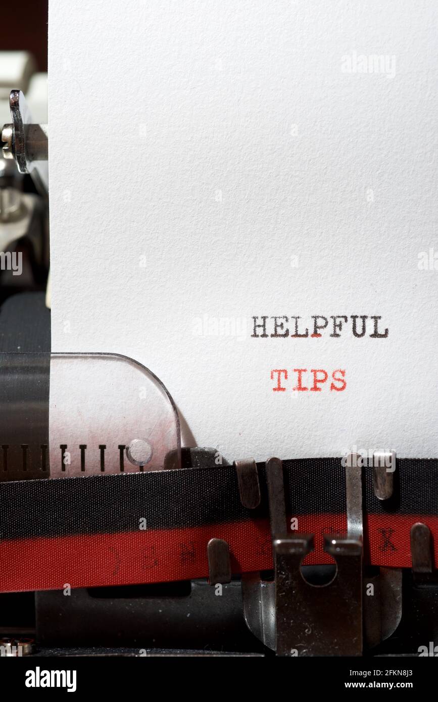 Helpful tips phrase written with a typewriter Stock Photo - Alamy