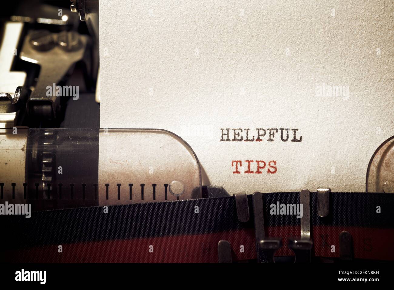 Helpful tips phrase written with a typewriter Stock Photo - Alamy