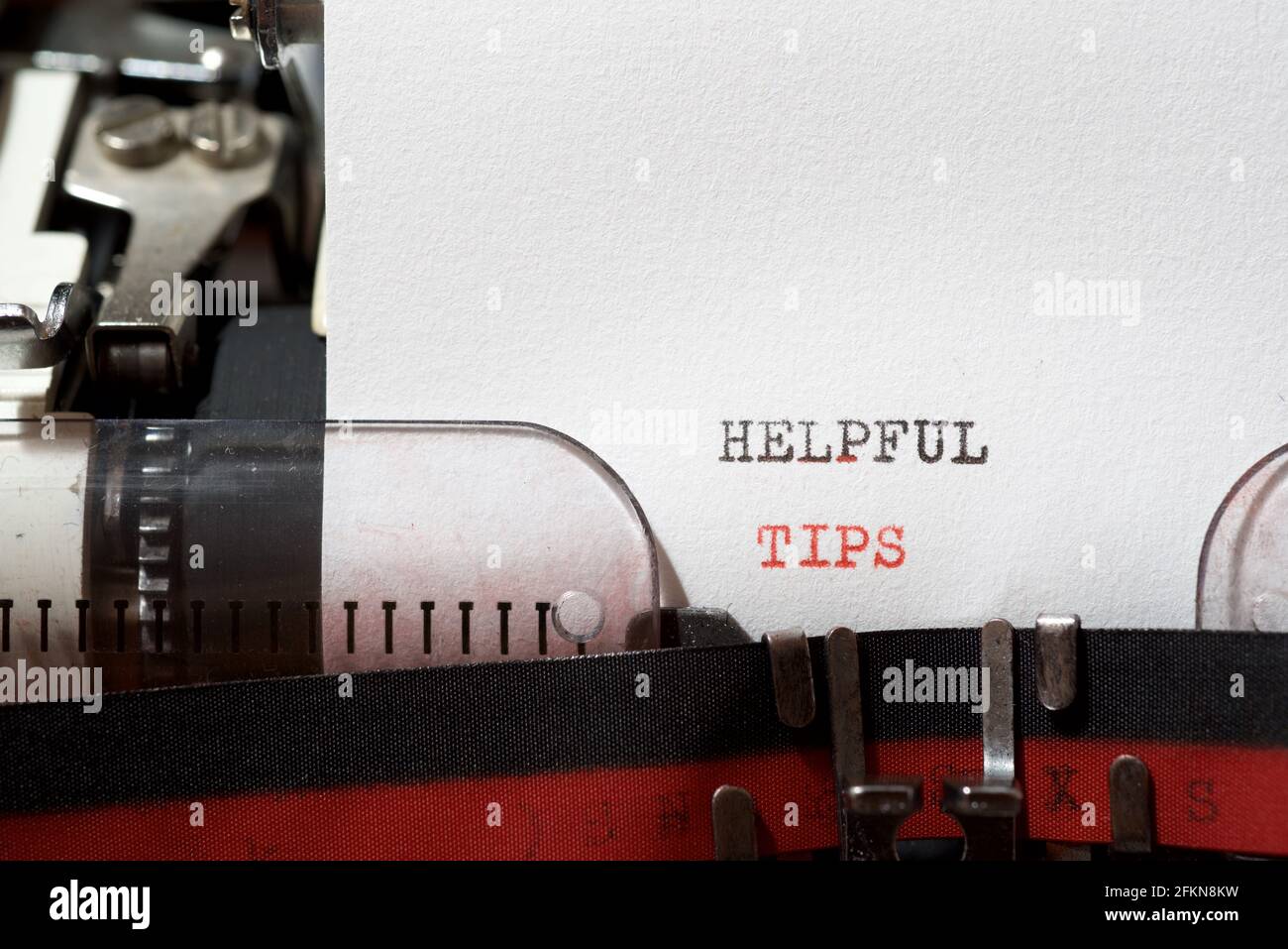 Helpful tips phrase written with a typewriter Stock Photo - Alamy