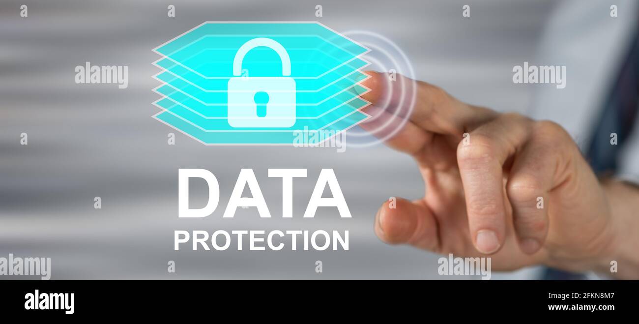 Man touching a data protection concept on a touch screen with his ...