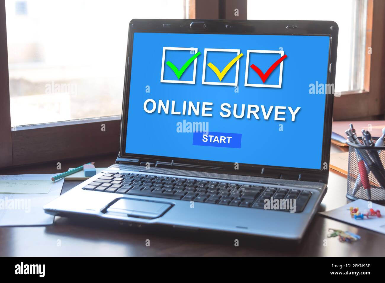 Laptop screen displaying an online survey concept Stock Photo - Alamy