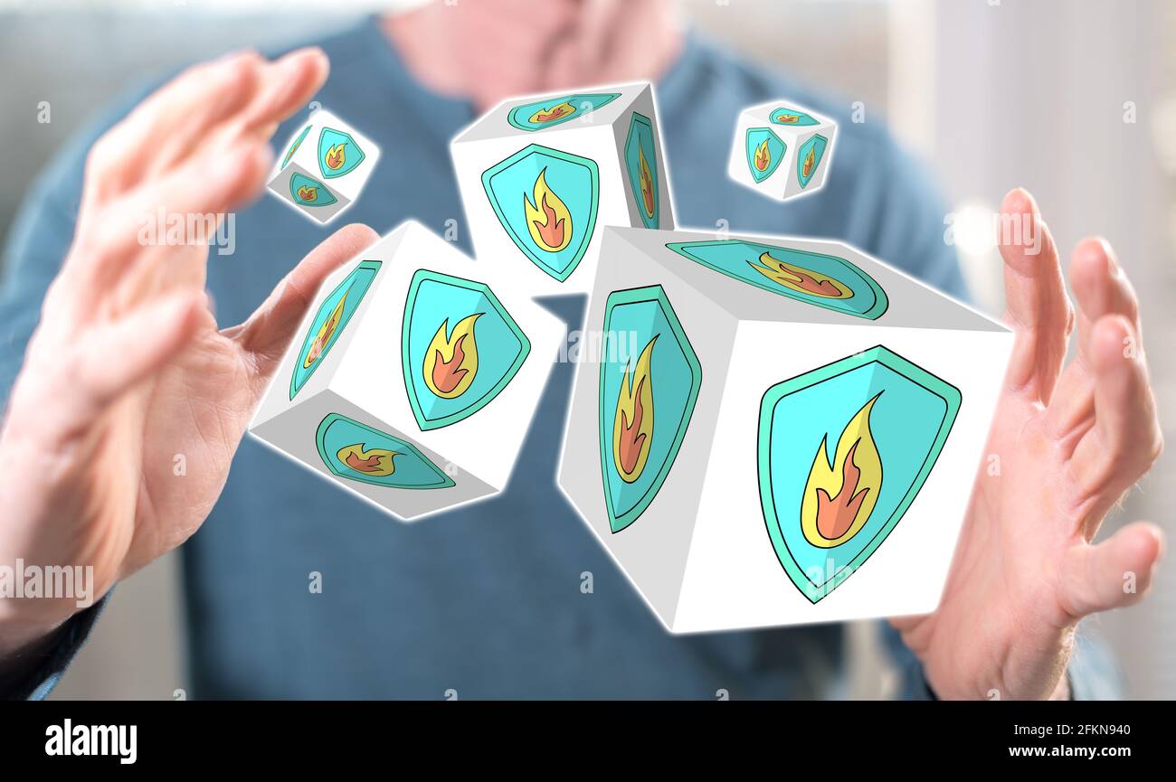 Fire protection concept between hands of a man in background Stock ...