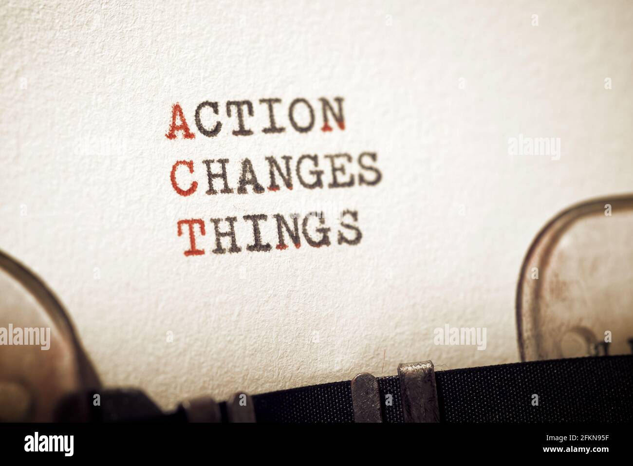 Action changes things phrase written with a typewriter Stock Photo - Alamy