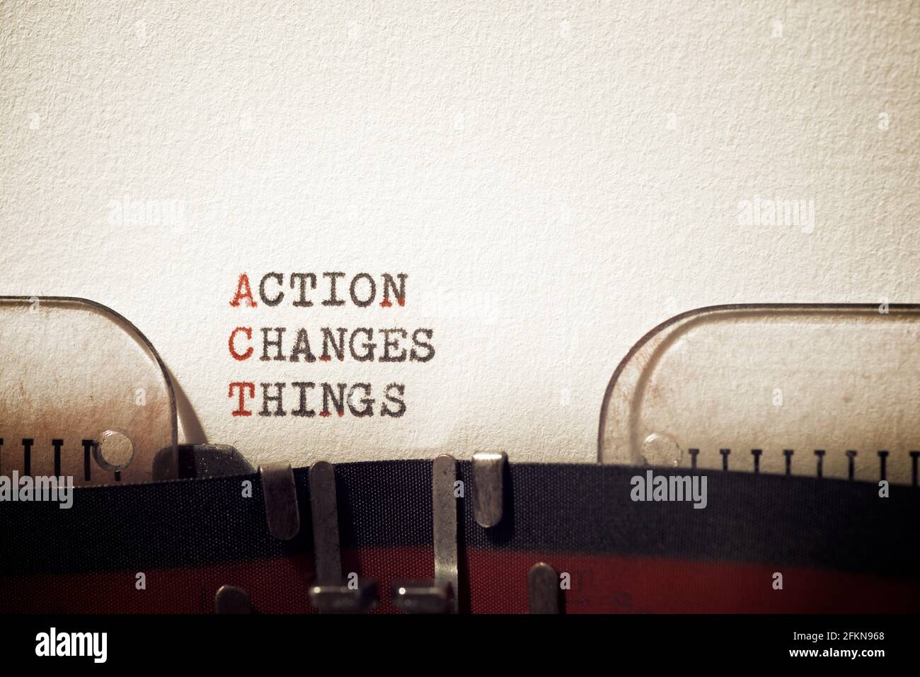 Action changes things phrase written with a typewriter Stock Photo - Alamy