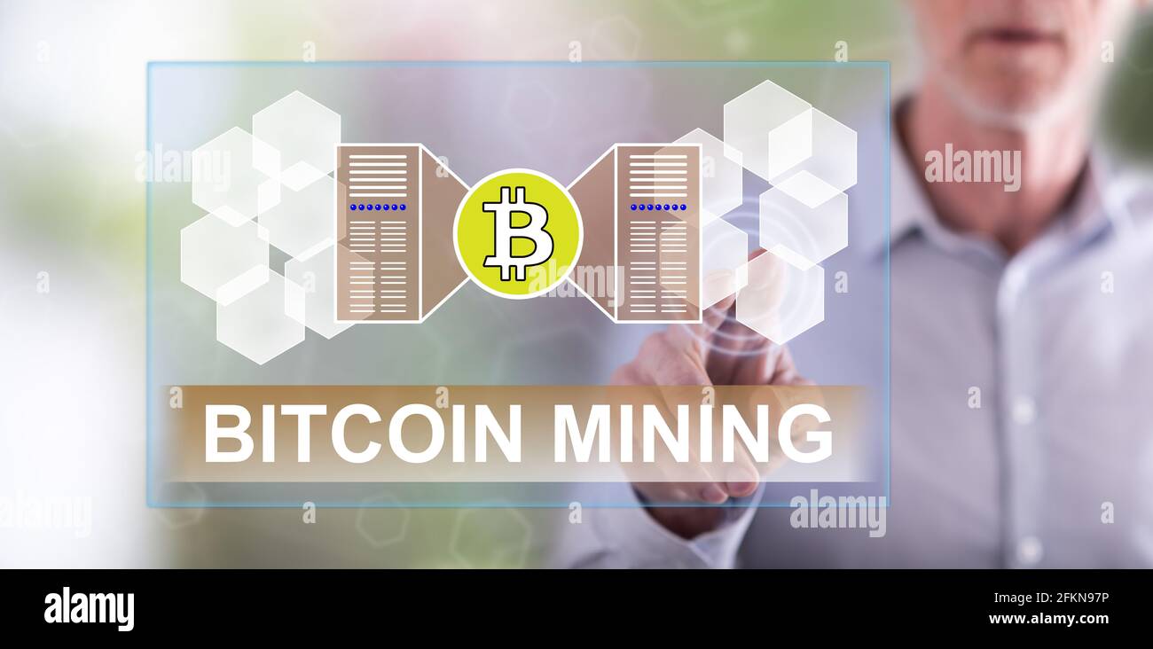 Man touching a bitcoin mining concept on a touch screen with his finger ...
