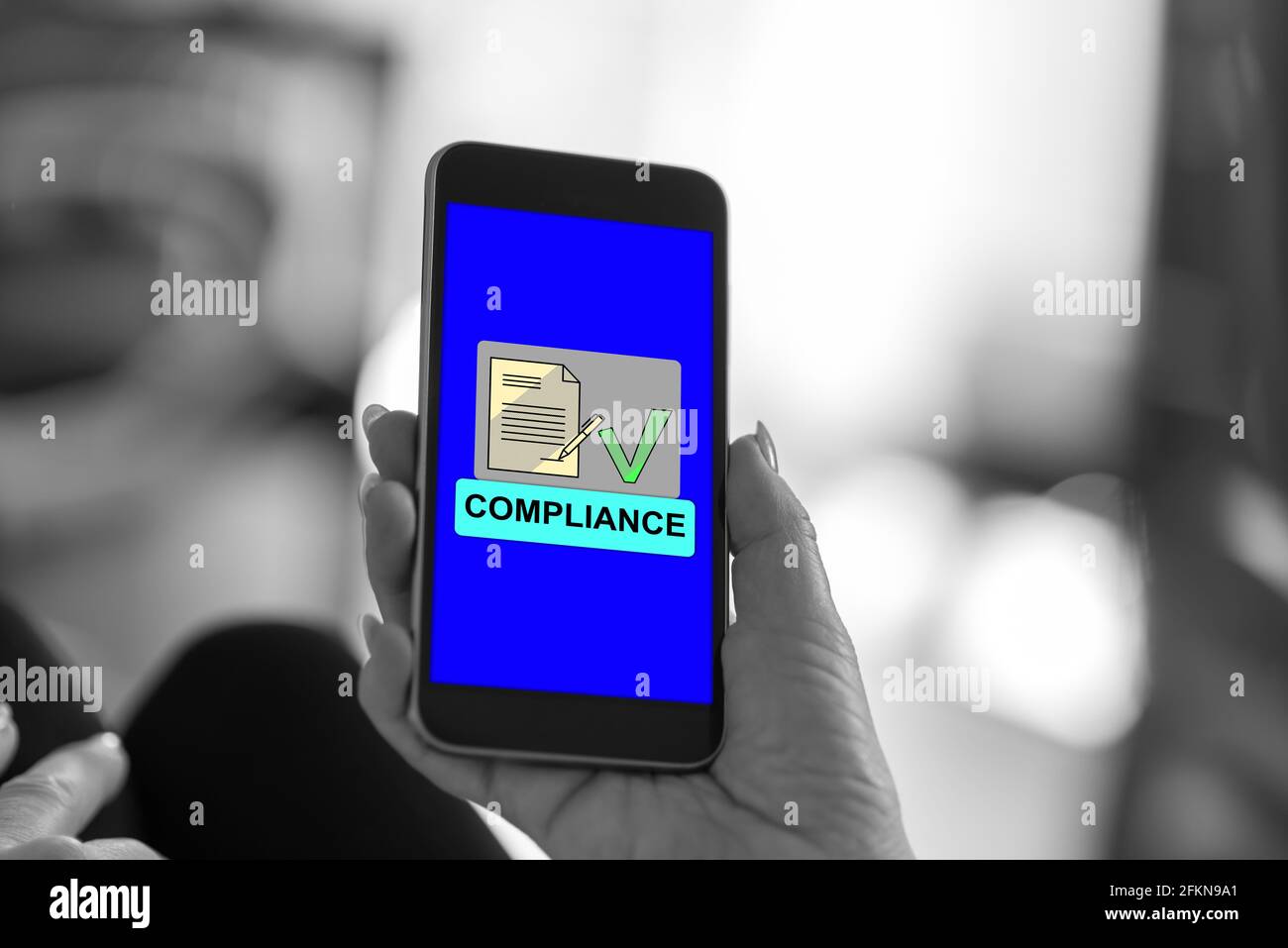 Smartphone screen displaying a compliance concept Stock Photo - Alamy