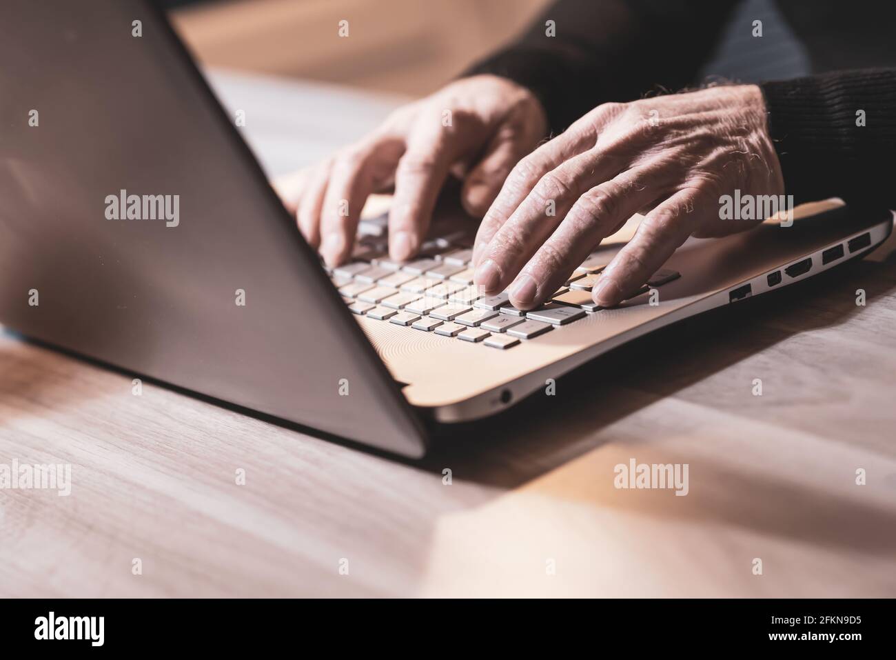 Male hands typing on laptop keyboard Stock Photo - Alamy