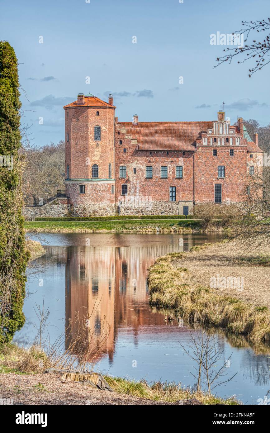Torups Slott (Torup Castle) orange facade lake reflection. Water ...