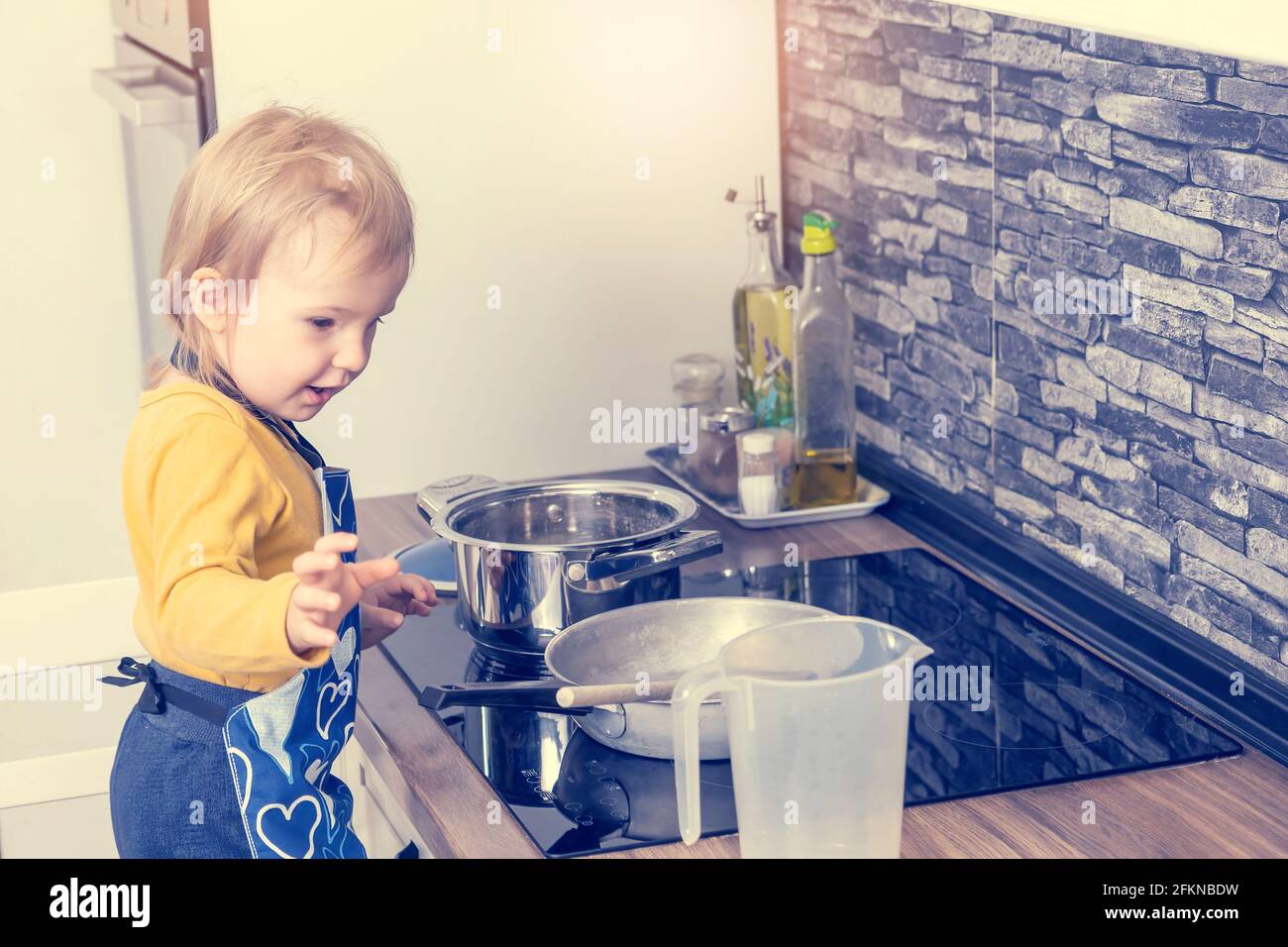 Funny cooking by little boy in the kitchen concept. Horizontally Stock ...