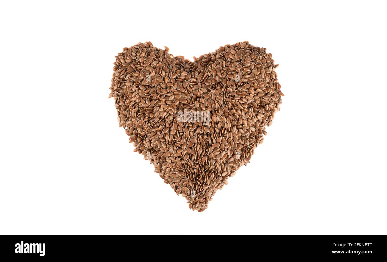 Heart shaped pile of flax seeds isolated on white background. Top view. Super food Stock Photo ...