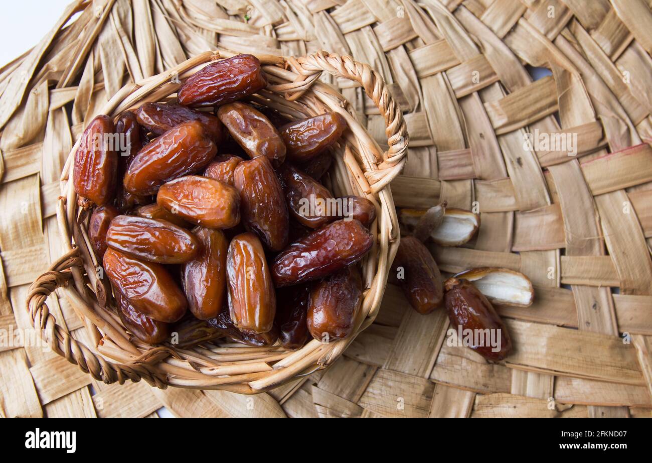Bunch of dried date fruits in a bowl Stock Photo - Alamy
