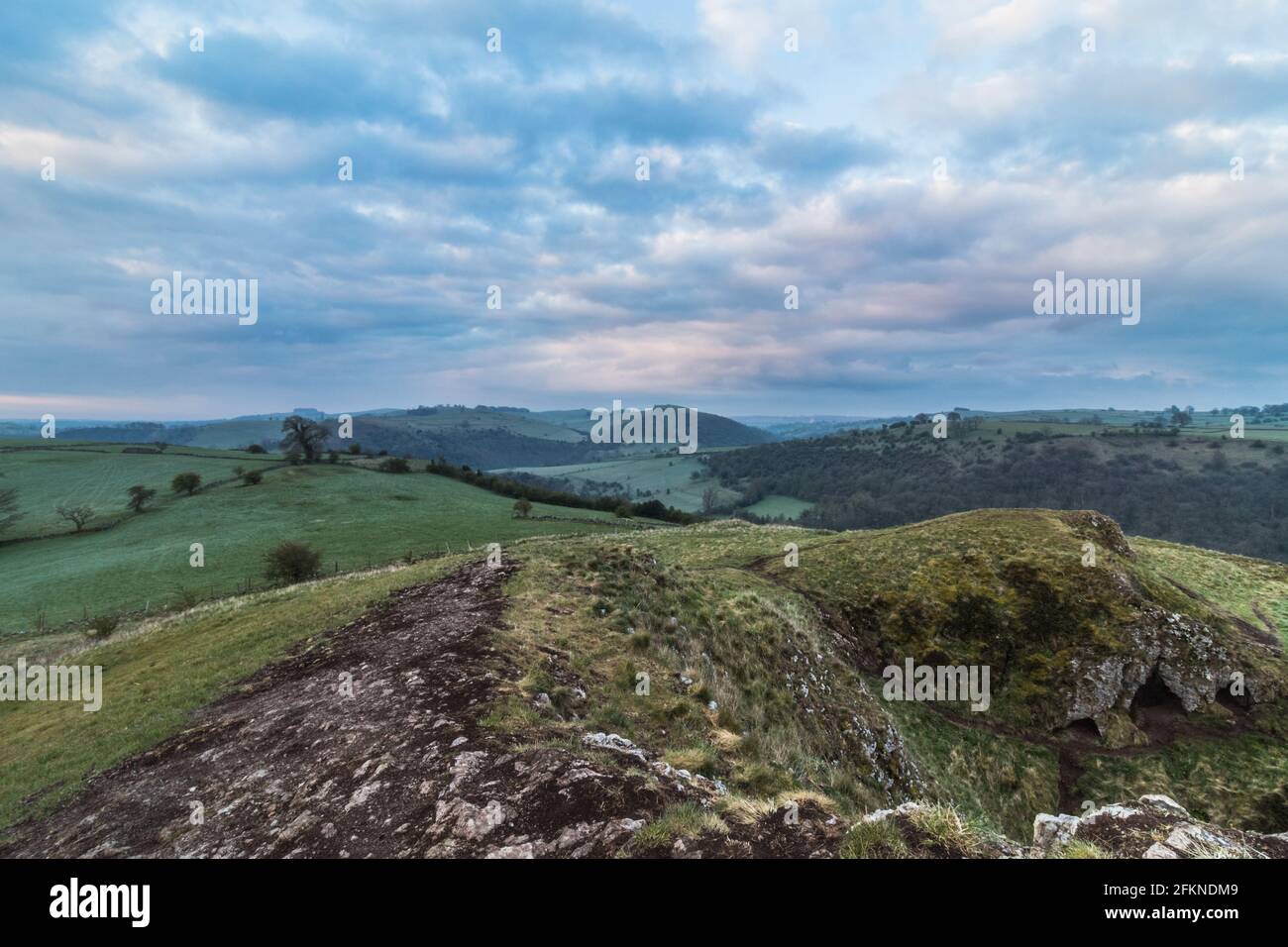 Climbing up in the mount on the morning in the Peak District, Thor Cave ...