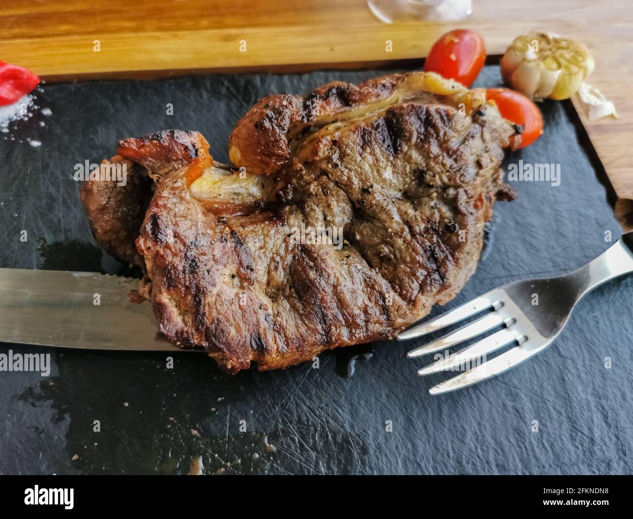 Detailed view of a sliced portion beef on fork, grilled beef steak with ...