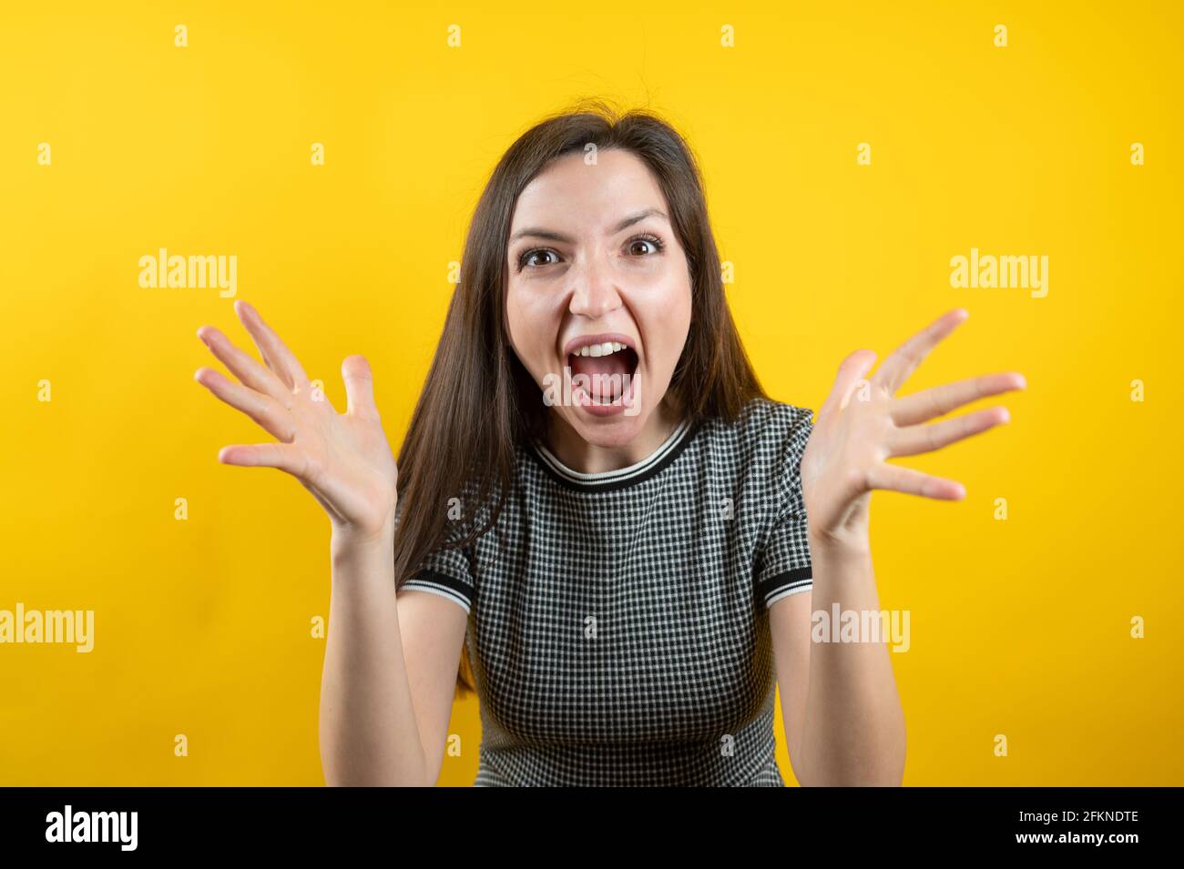 Portrait of a screaming young girl, on a yellow background Stock Photo ...