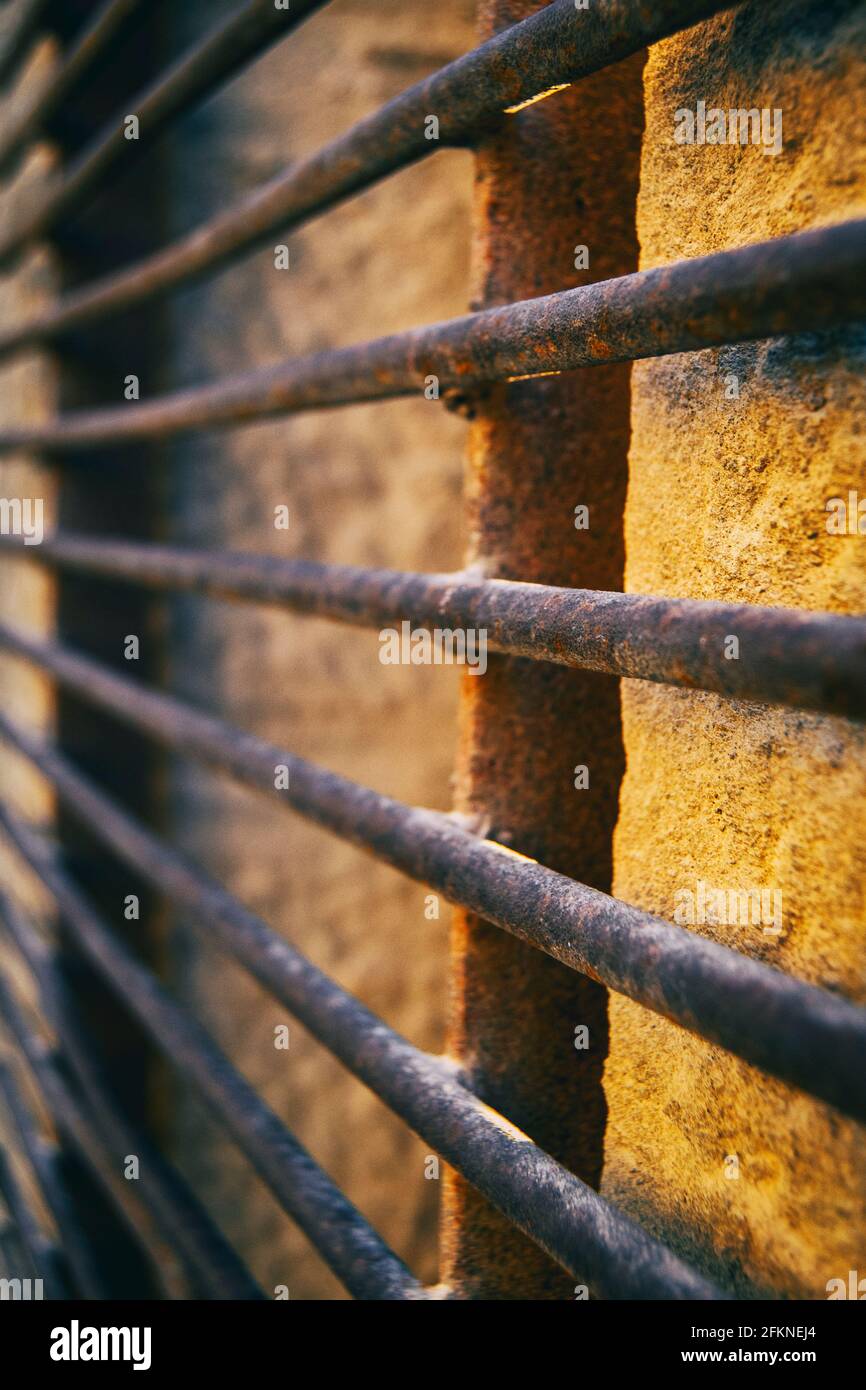 window with a rusty grille with a wrought iron pattern Stock Photo - Alamy