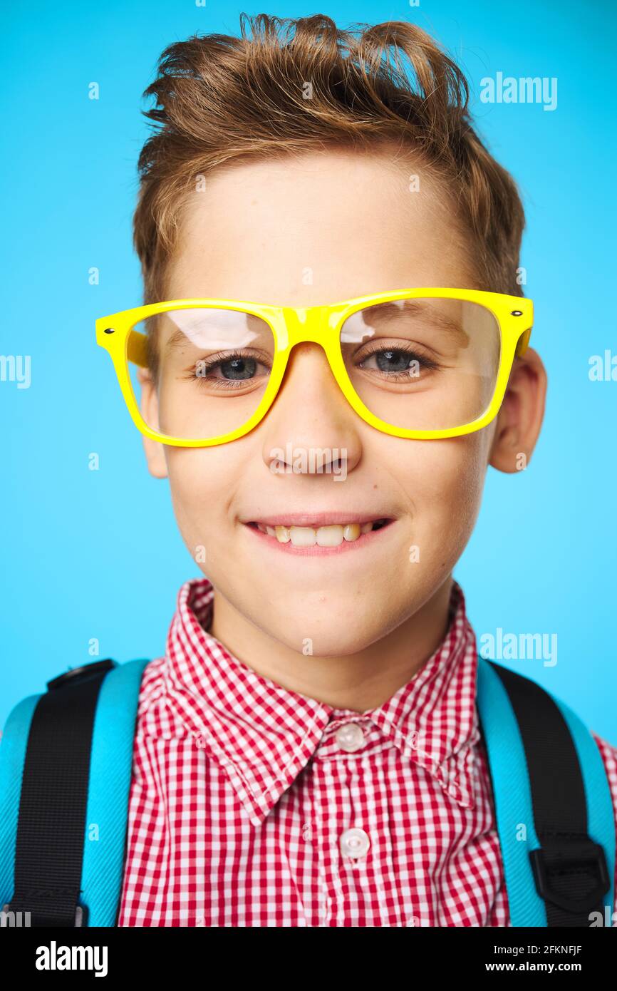 boy wearing glasses backpack school education blue background Stock ...