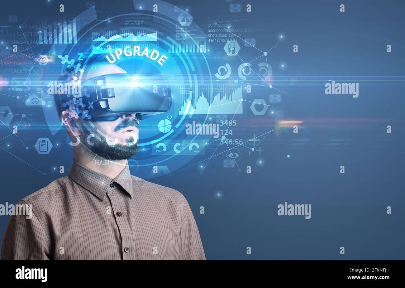 Businessman looking through VR glasses Stock Photo - Alamy