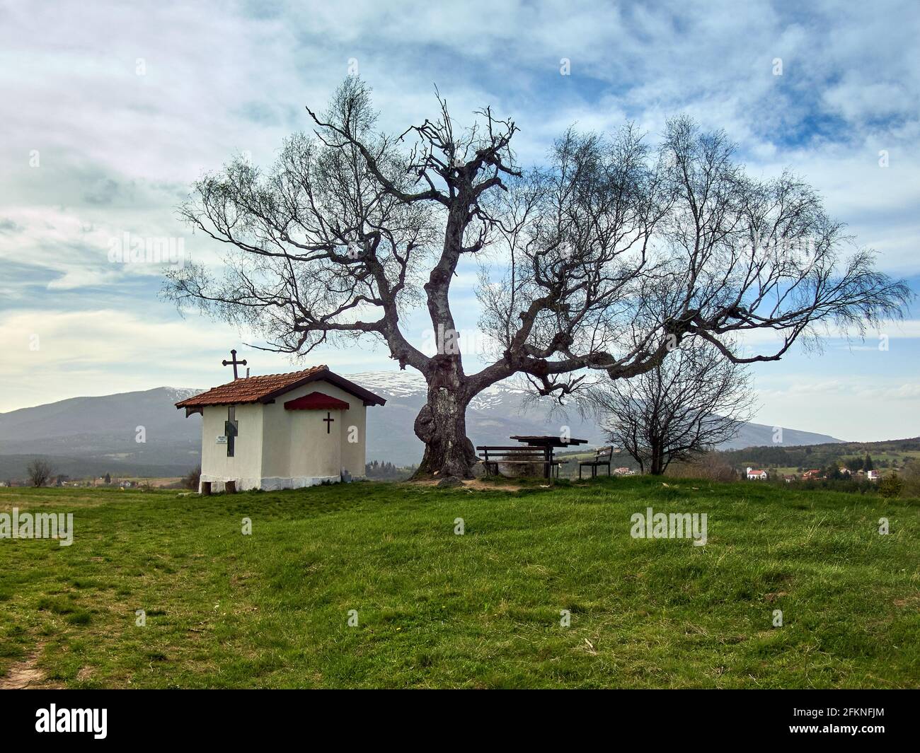 A small rural chapel in the mountains of Bulgaria, next to a lonely ...