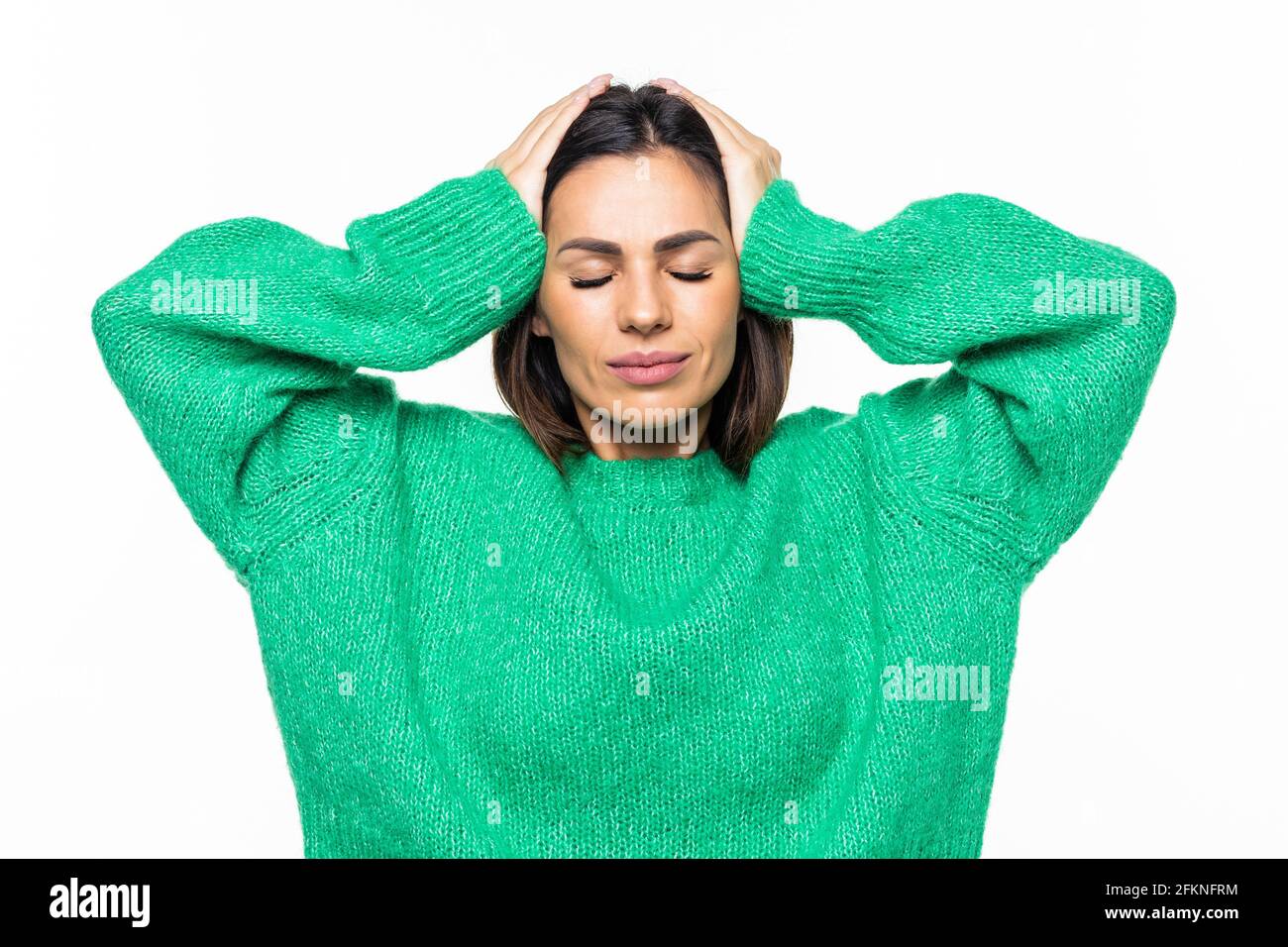 Young woman disappointed hands on head on white background Stock Photo ...