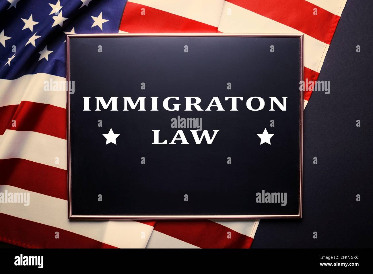 Blackboard with text IMMIGRATION LAW on USA flag background Stock Photo ...