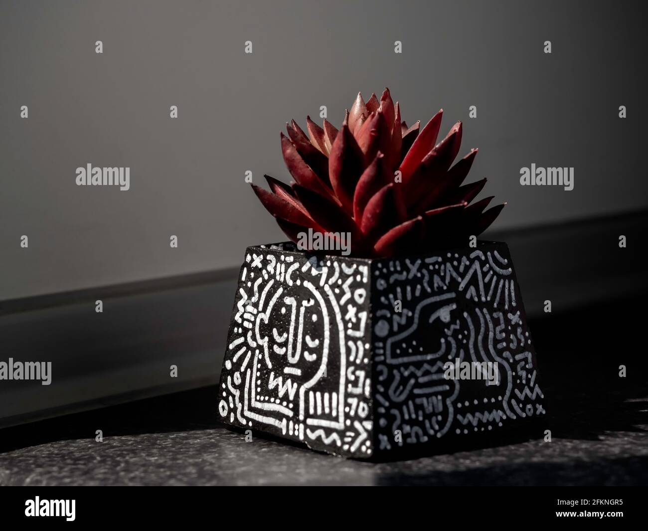 DIY black concrete pot, pyramid shape with art drawing with red ...