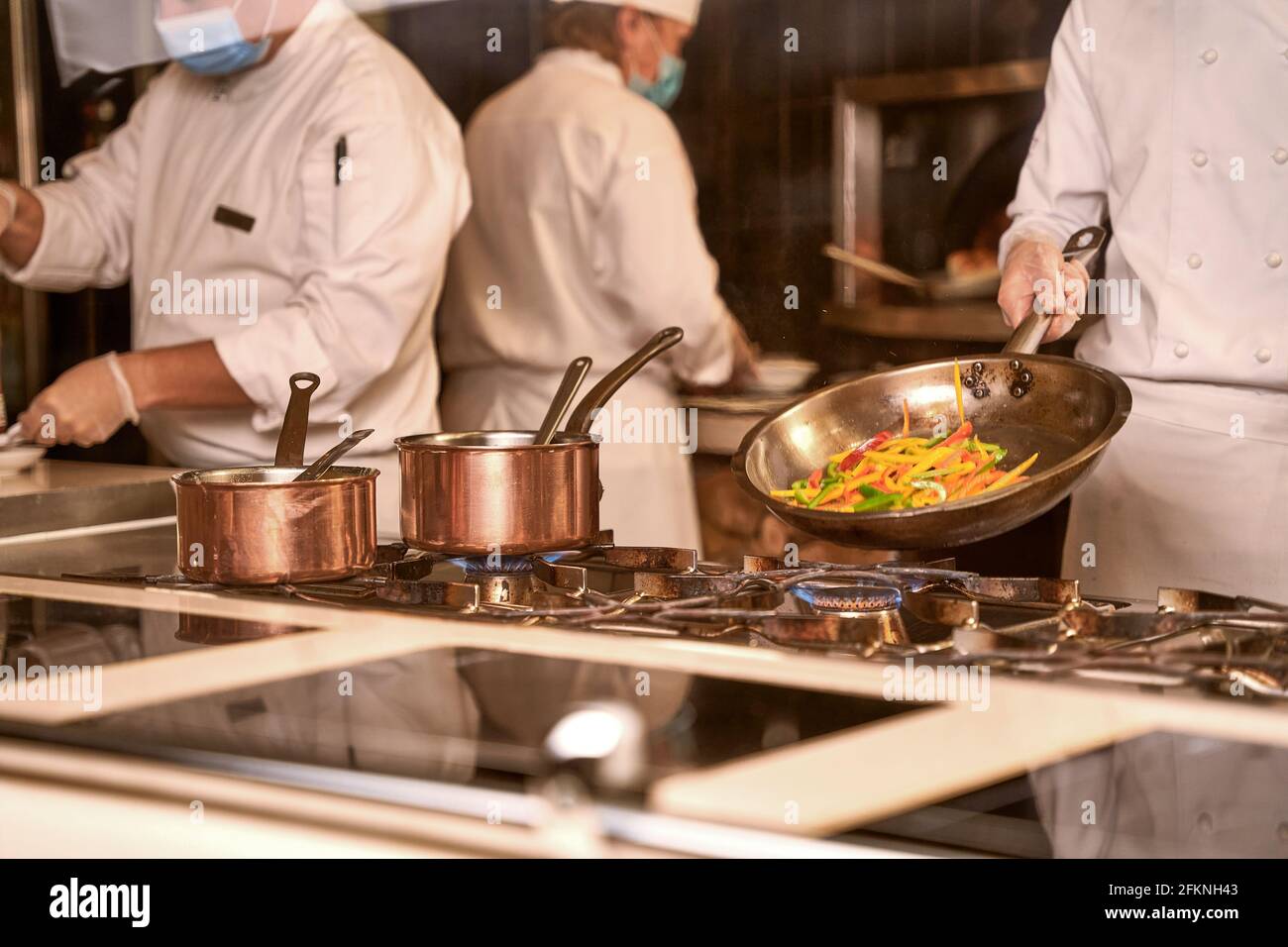 Chef slices vegetables on restaurant hi-res stock photography and ...