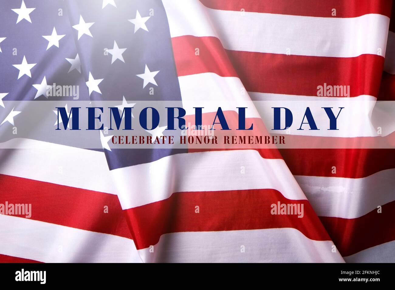 Memorial day weekend translucent text written on ruffled USA flag ...