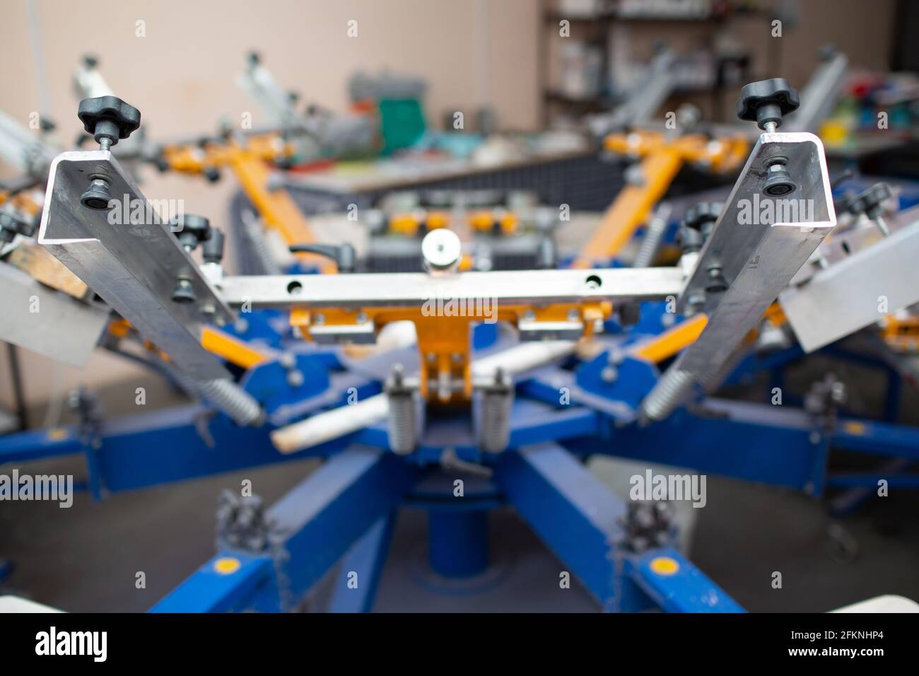 Serigraphy silk screen print process at clothes factory. Carousel Frame ...